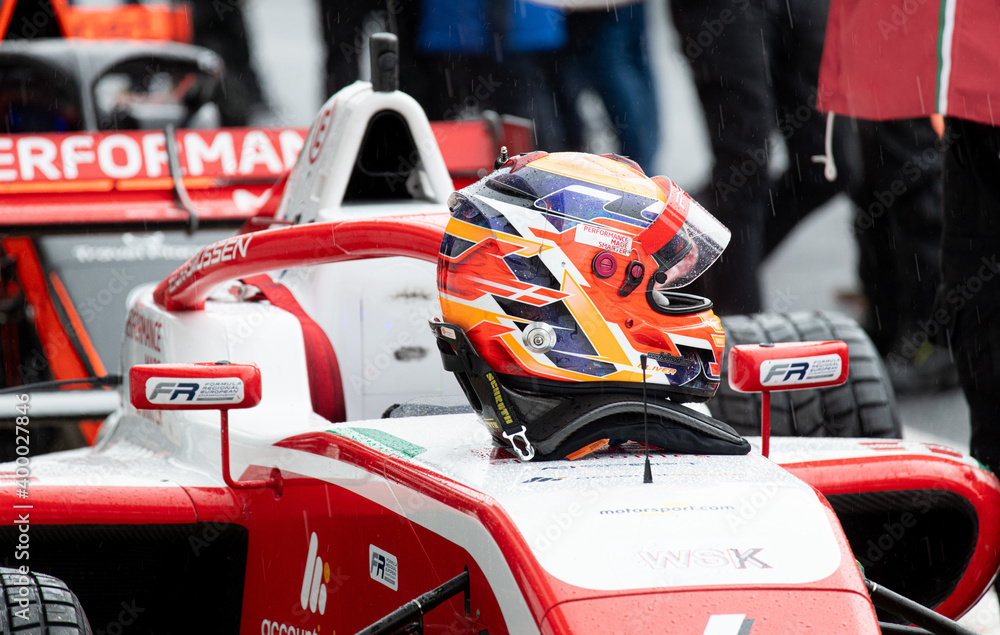 Driver helmet on racing single seater red car motorsport background ...
