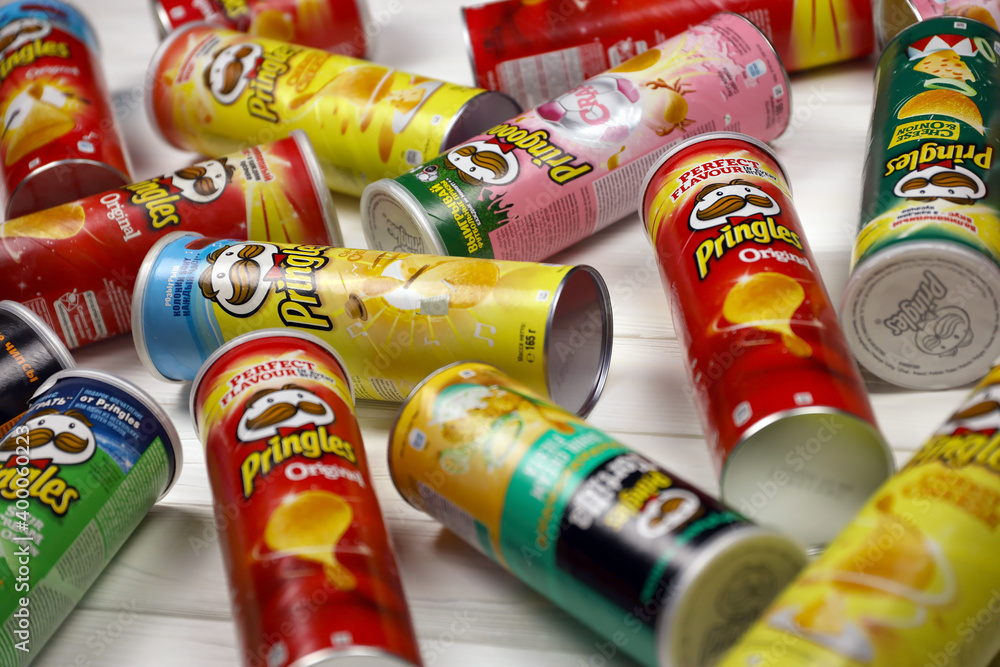 Pringles variety of flavors. Many cardboard tube cans with Pringles ...