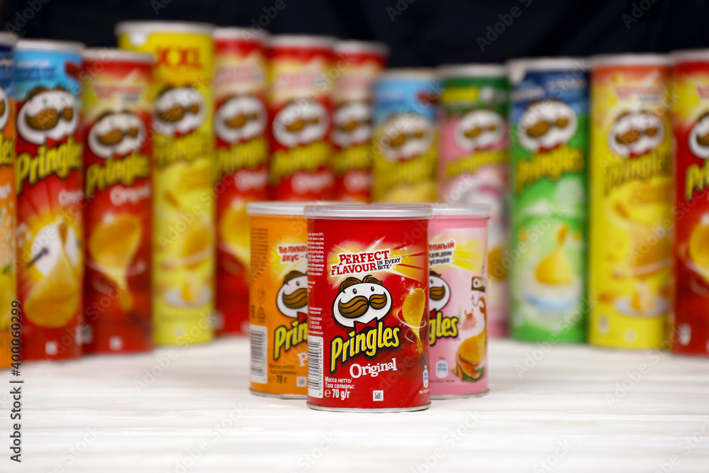 Pringles variety of flavors. Many cardboard tube cans with Pringles ...