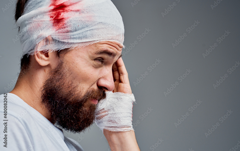 a man with a bandaged head blood resuscitation surgery model gauze on ...