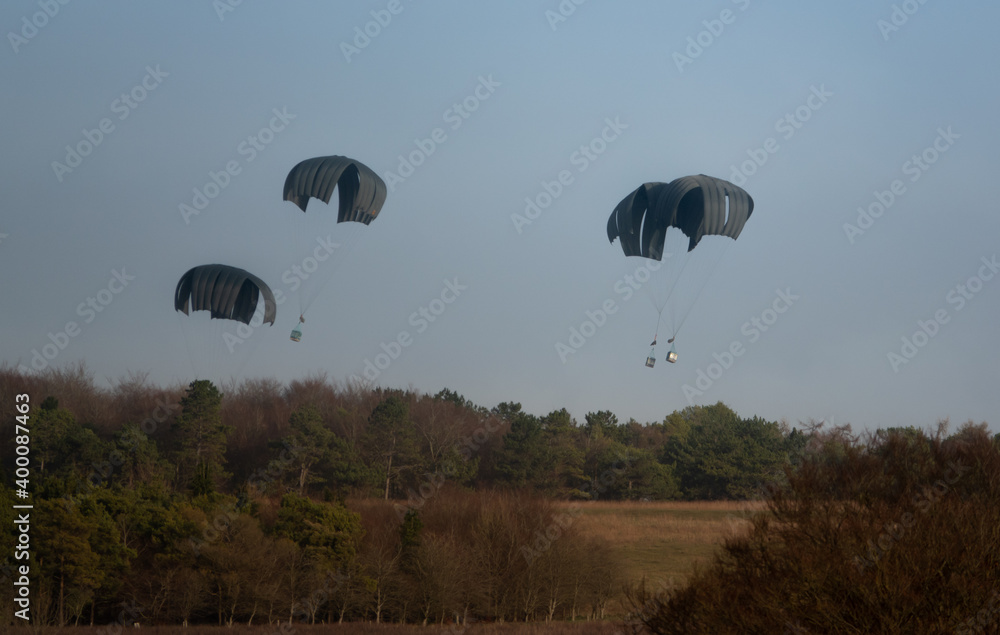 Stockfoto four large cargo drop parachutes about to hit the ground two ...