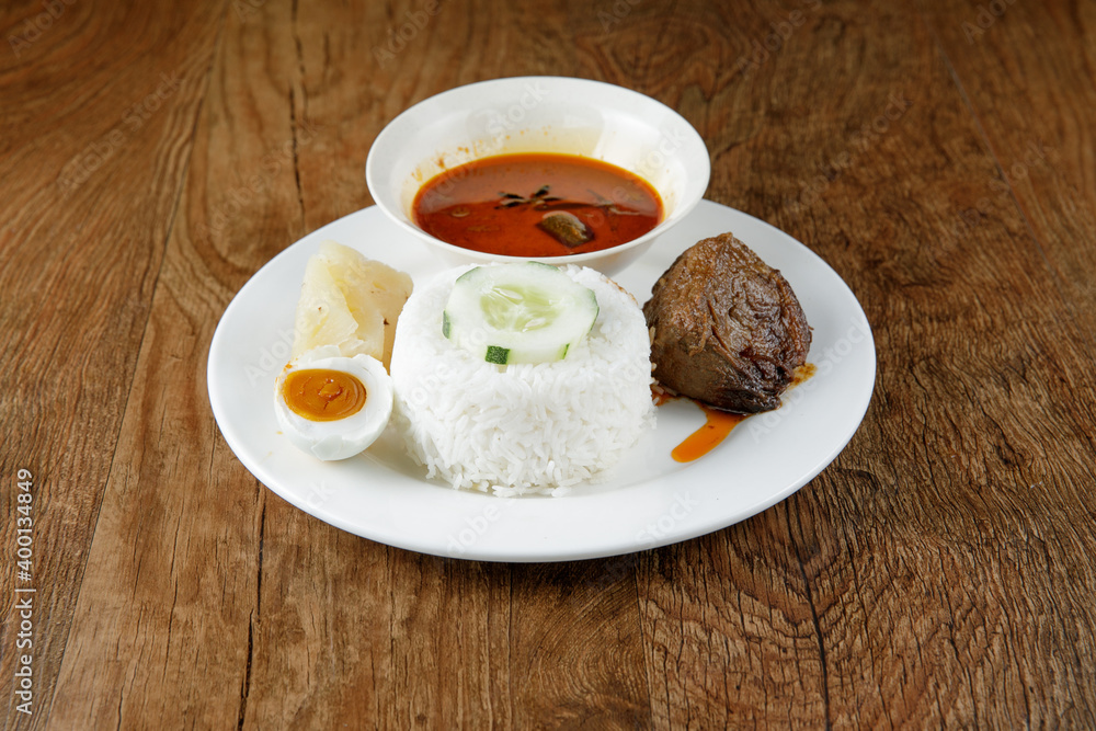 Nasi kukus daging kari, popular traditional Malay local food. Stock ...
