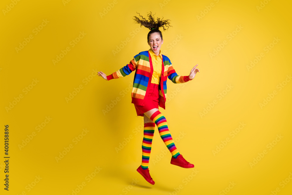 Full length photo of cheerful teen girl jump wear rainbow outfit ...