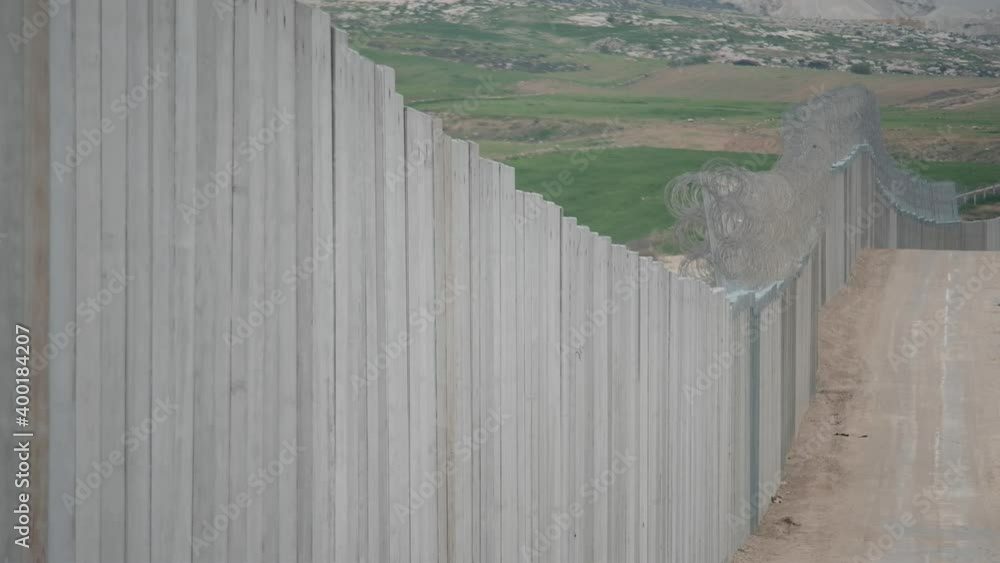 Barbed wire on top of the separating wall between Israel and the ...