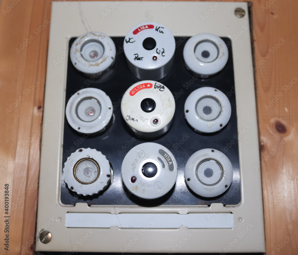 Old fuse box with ceramic fuses and some handwritings on it. Stock ...