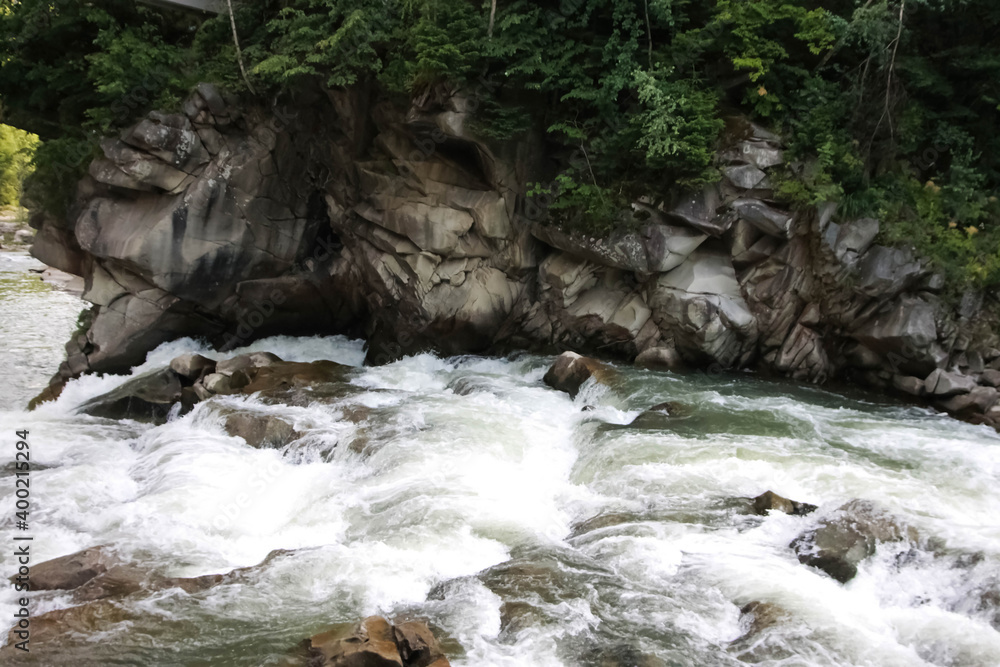 Large strong rocks are located above the water Stock Photo | Adobe Stock