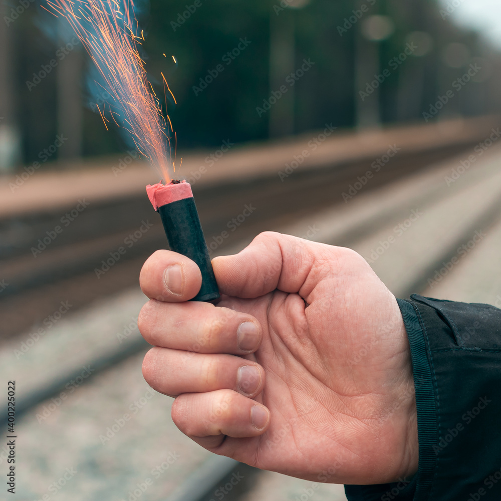The Firecracker in a Hand. Man Holding a Burning Petard in His Hand. A ...