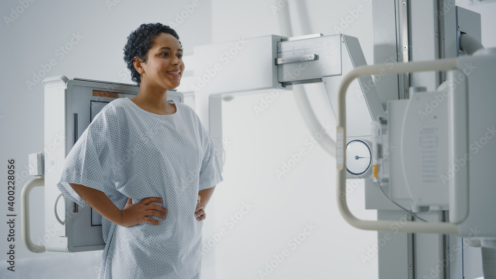 Hospital Radiology Room: Beautiful Smiling Latin Woman Standing next to ...