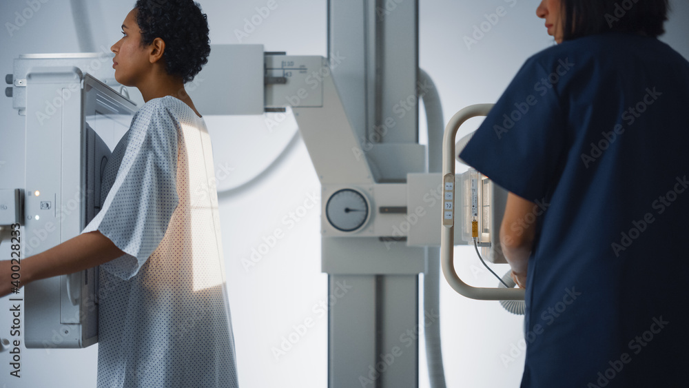Hospital Radiology Room: Beautiful Latin Woman Standing while Female ...
