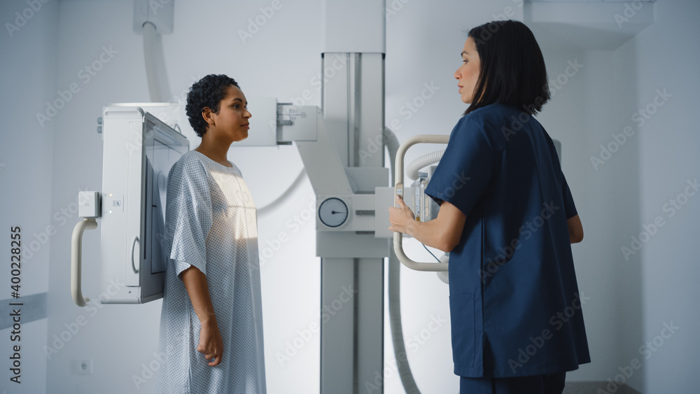 Hospital Radiology Room: Beautiful Latin Woman Standing while ...