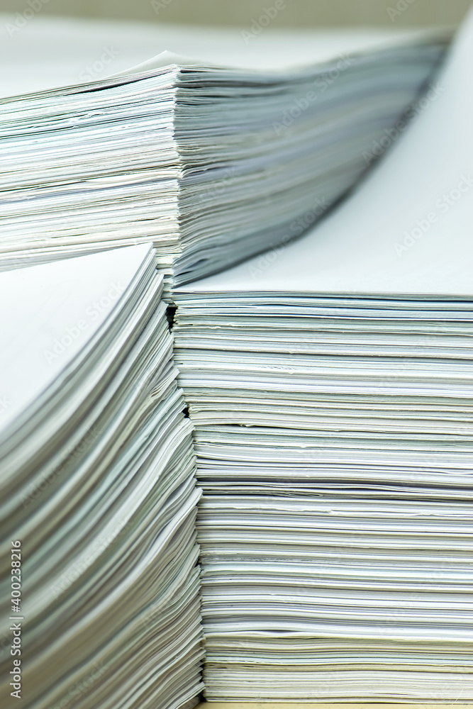 bundles bales of paper documents. stacks packs pile on the desk in the ...