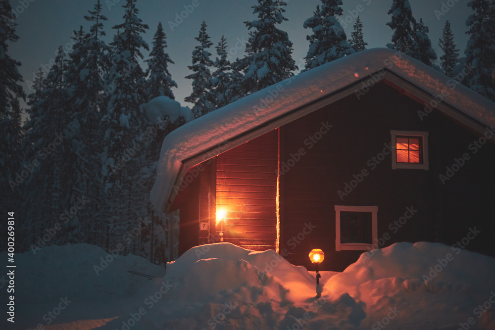 A night view of cozy wooden scandinavian cabin cottage chalet house ...