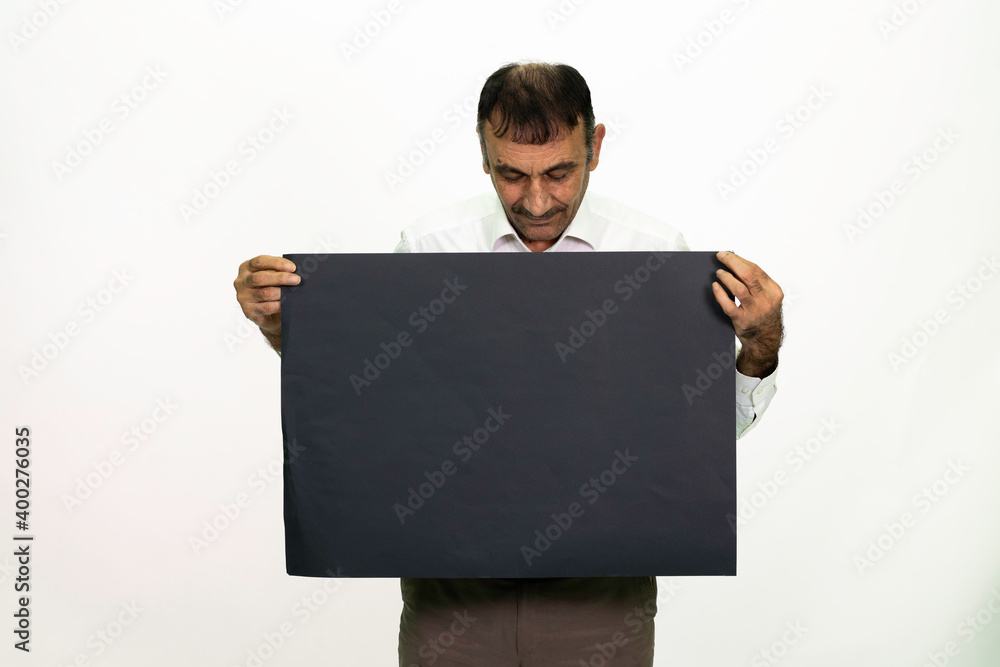 Man holding a black banner in his hand. It can be written on. She is ...