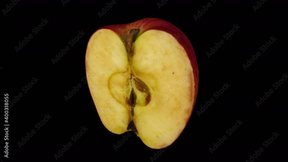 Realistic render of a rotating half Red Delicious apple on transparent ...