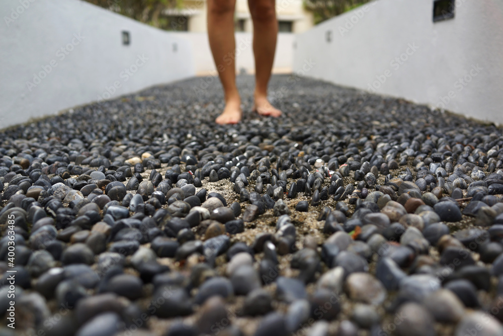 Cropped image woman feet walking on cobble pavement, healthy lifestyle ...
