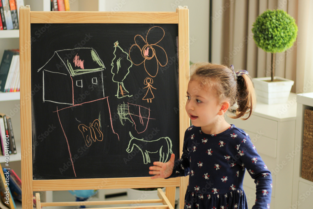Little girl drawing picture with pencils and watercolor. Drawing kid ...