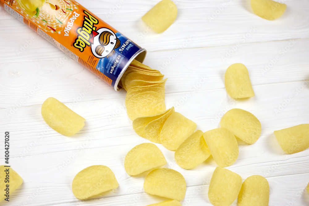 Pringles paprika flavour. Cardboard tube can with Pringles potato chips ...