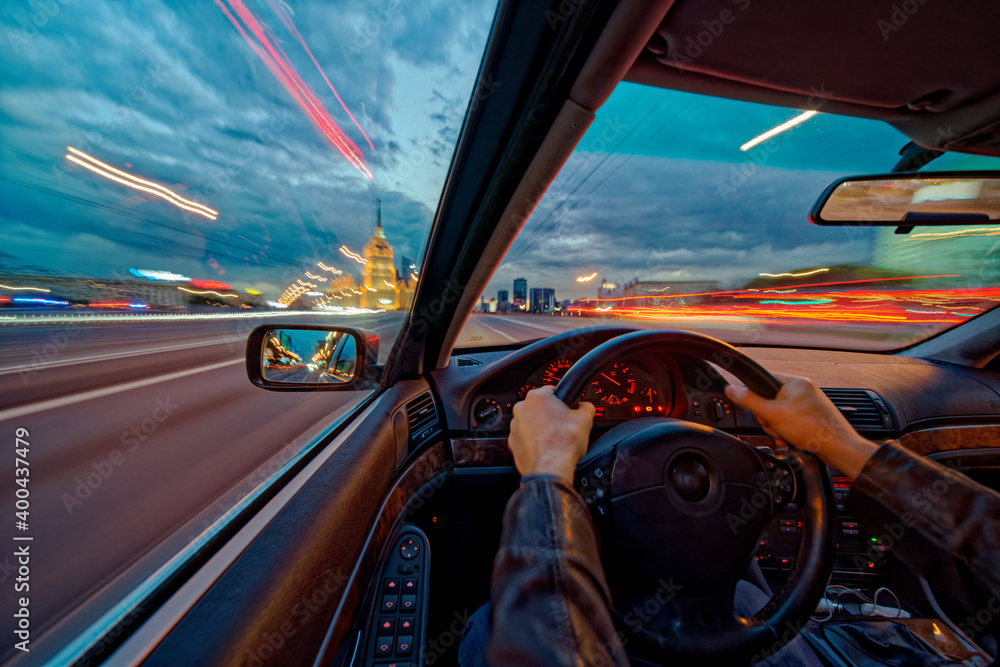 Movement of the car at night at high speed view from the interior with ...