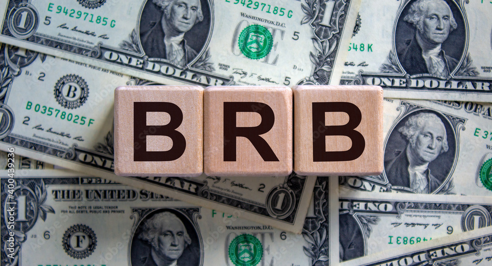 BRB symbol. Wooden cubes with word 'BRB - be right back' on a beautiful ...