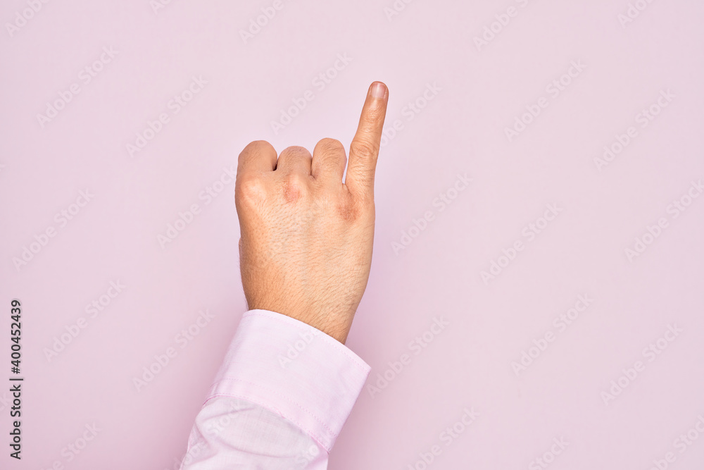 Hand of caucasian young man showing fingers over isolated pink ...
