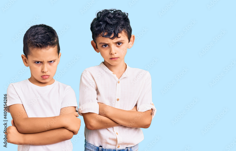 Couple of little brothers together wearing casual clothes skeptic and ...