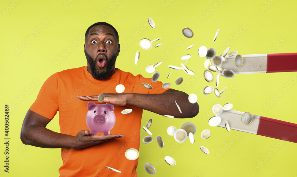Man tries to protect his piggybank from a big magnet that ruba steals ...