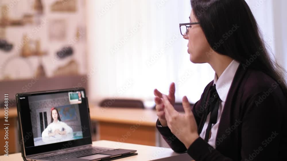 Online schooling, e-learning. Female teacher is holding online lesson ...