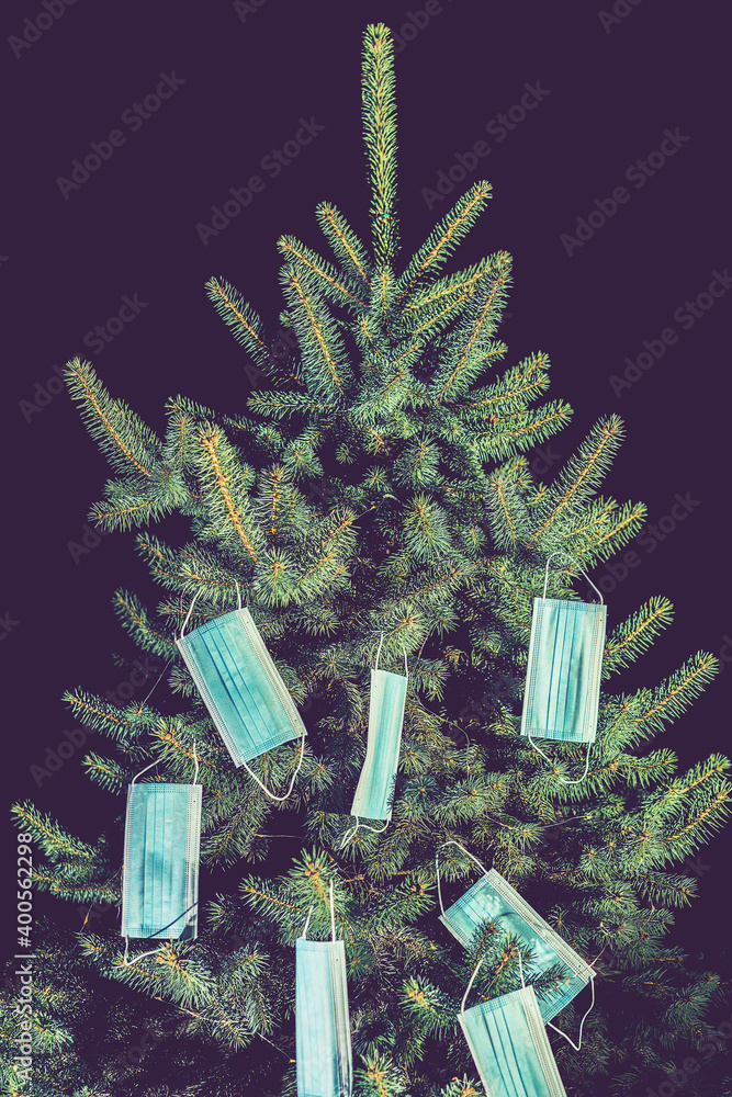 Christmas tree decorated with medical disposable medical masks ...