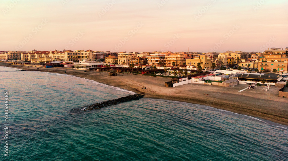 Sunset Rome aerial view in Ostia Lido beach over blue satin sea and ...