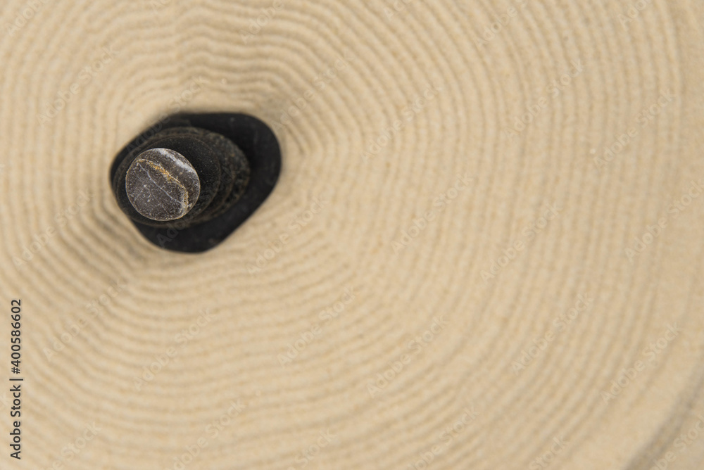 Zen sand garden meditation stone background with copy space. Stones and ...