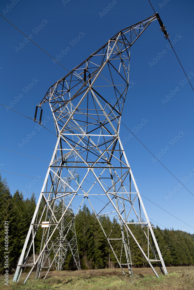 An upward left-side view of a single transmission tower in an open ...