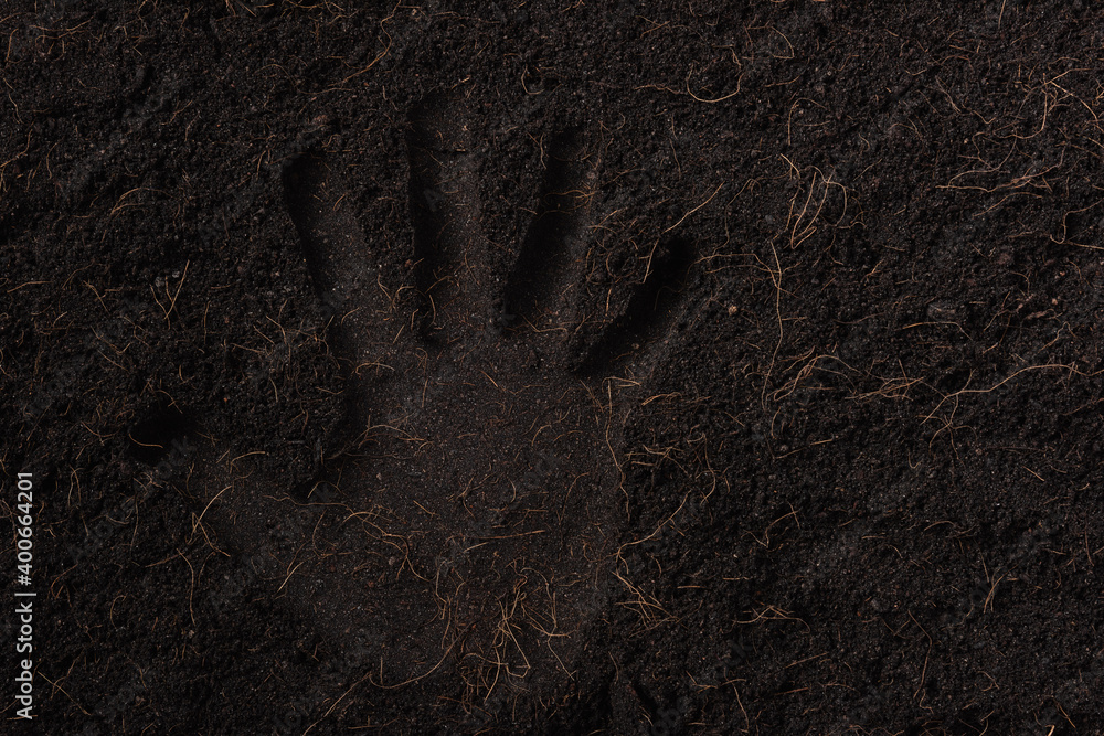 Hand print in black land for plant background, Top view of Handprint on ...