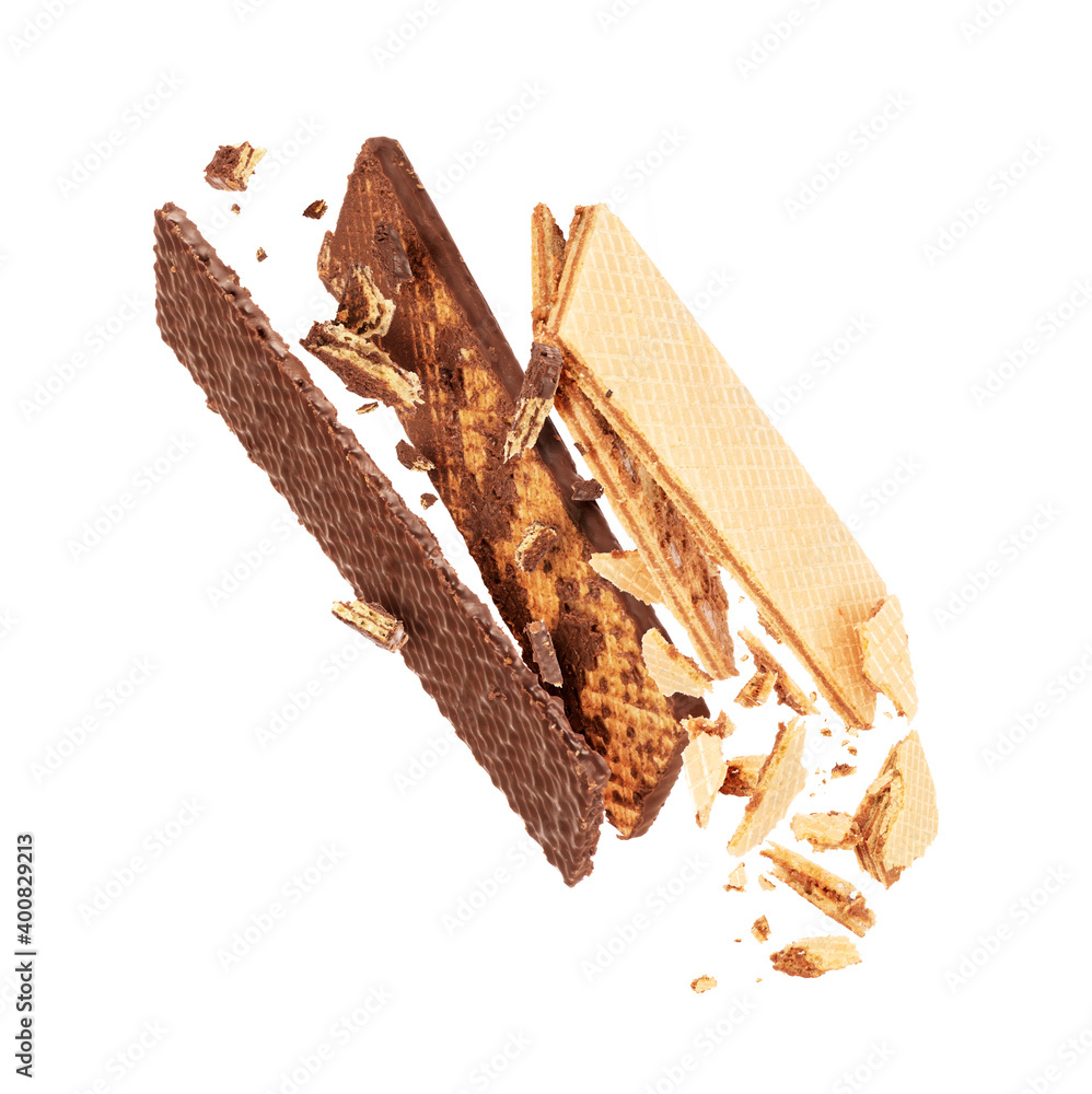 Chocolate and milky waffles crashed in the air on a white background ...