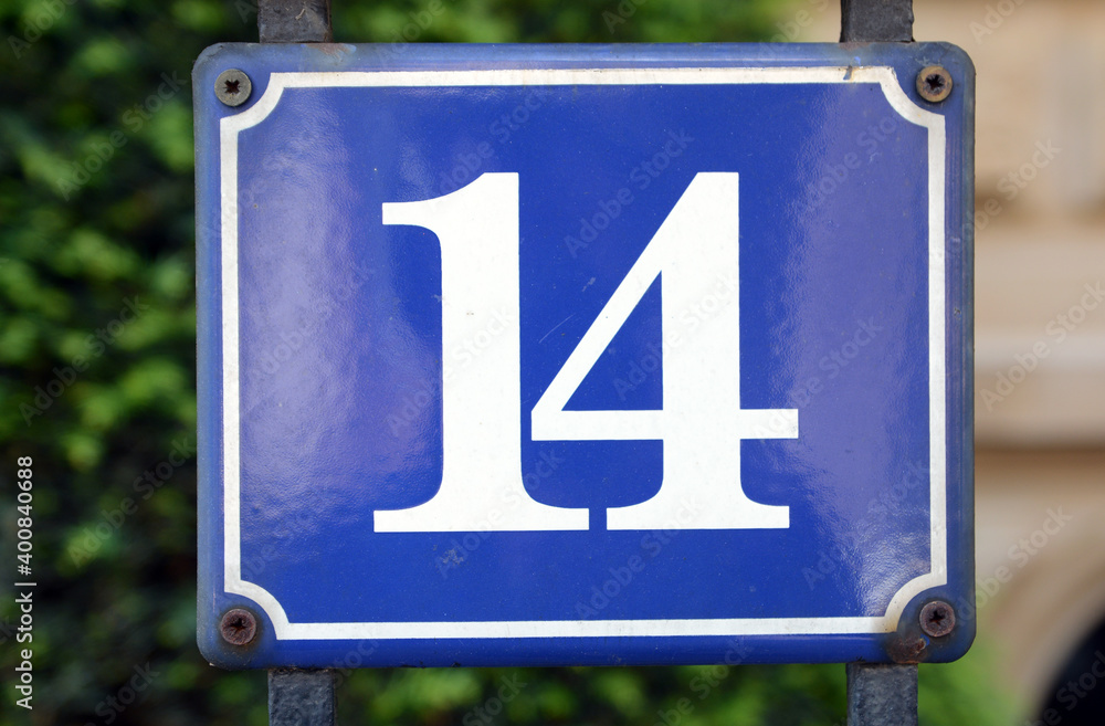 A blue house number plaque, showing the number fourteen (14) Stock ...