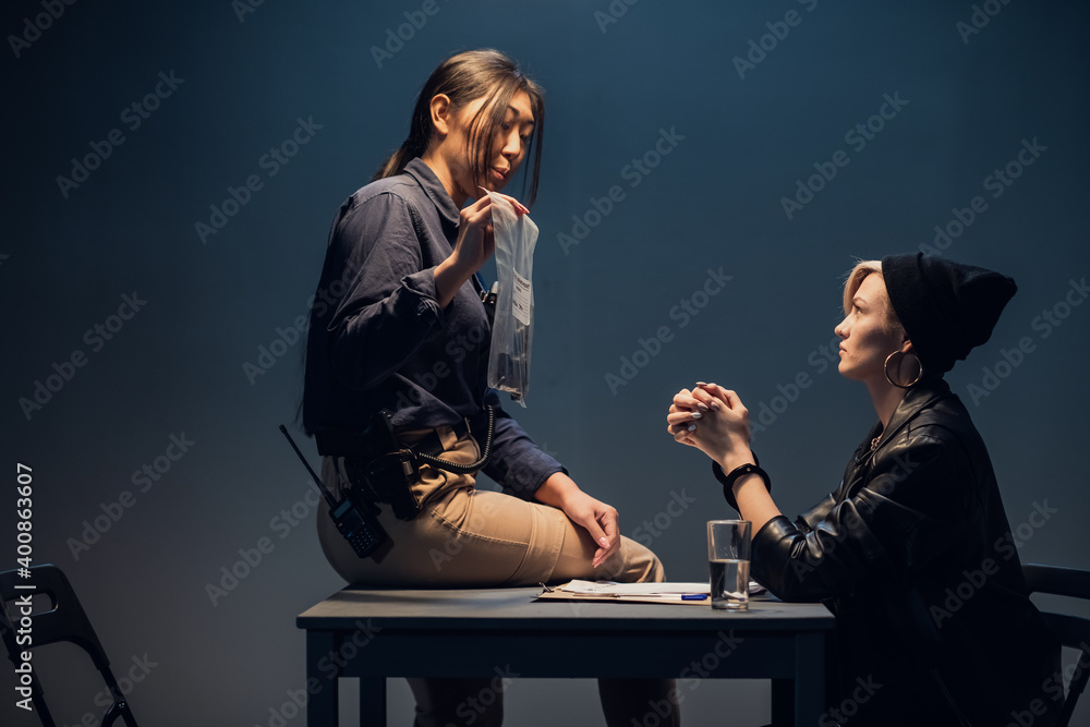 An experienced investigator during an interrogation at a police station ...