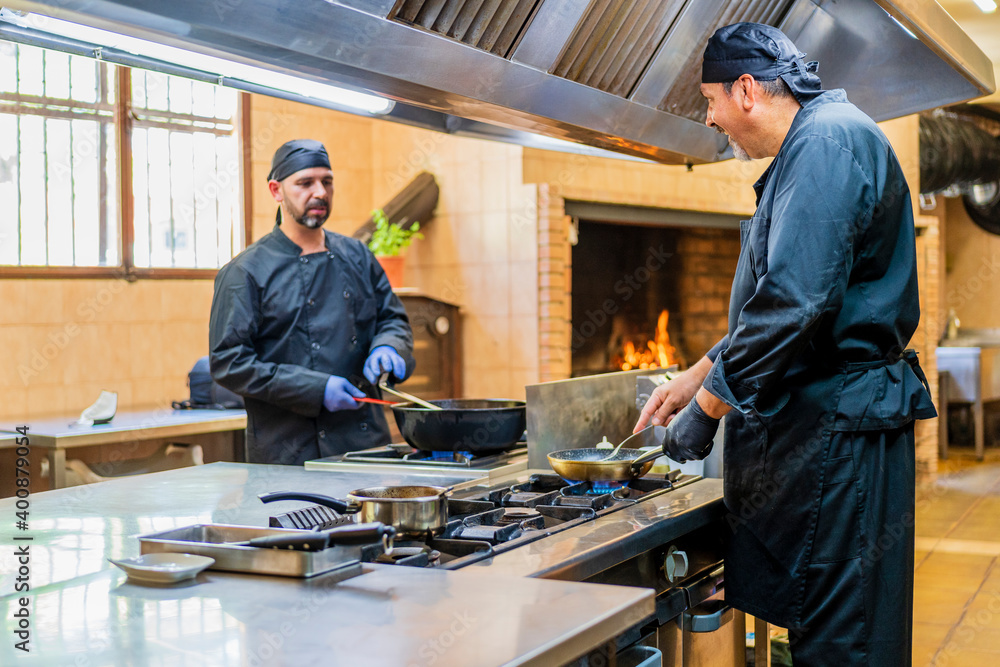 Traditional cooking in restaurant kitchen Stock Photo | Adobe Stock