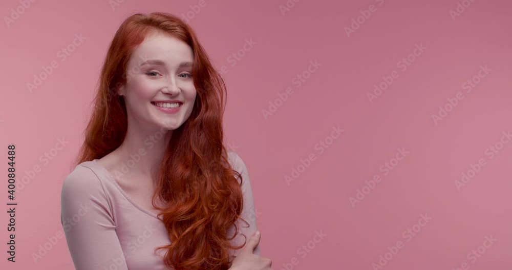 Cheerful Attractive female Model posing at the Studio on pink ...