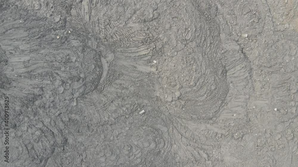 Drone aerial view of mud dirt ground in construction site in foggy day ...