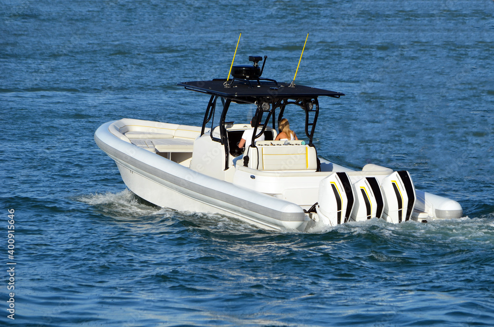 Pontoon motorboat powered by three outboard engines Stock Photo | Adobe ...