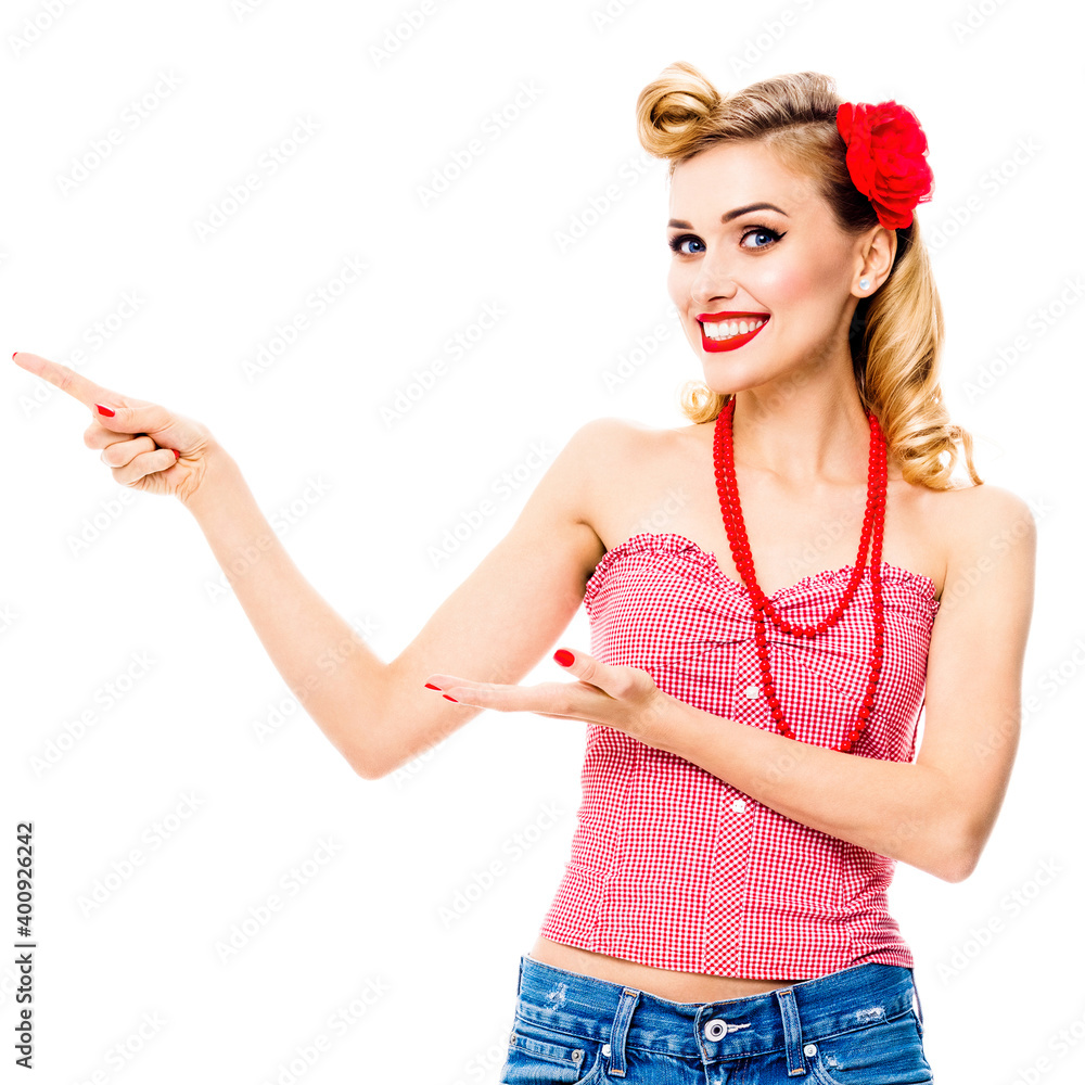 Portrait image - happy smiling blond woman pointing at something ...