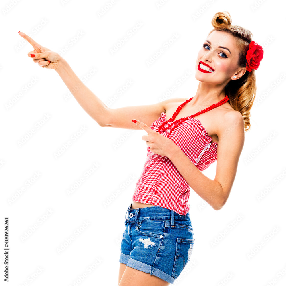 Portrait image - amazed smiling woman pointing at something. Excited ...