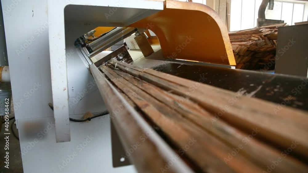 Sawing machine at wood production factory. Timber material processing ...