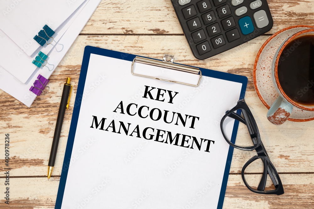 KEY ACCOUNT MANAGEMENT is written in a document on the office desk ...