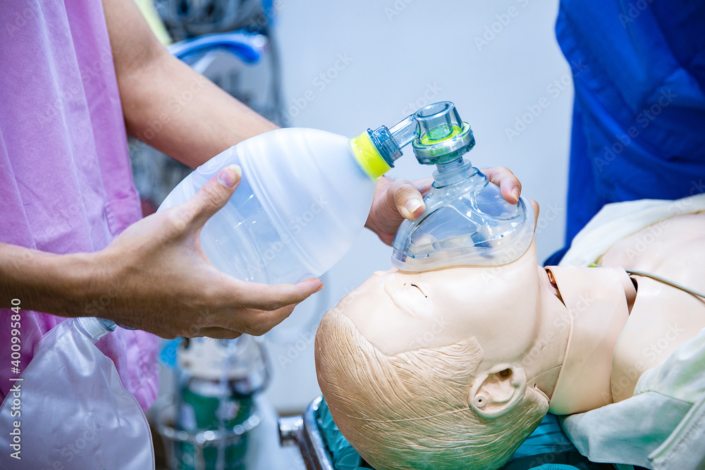 Photo & Art Print Hands holding a ambu bag on dummy patient, first aid ...