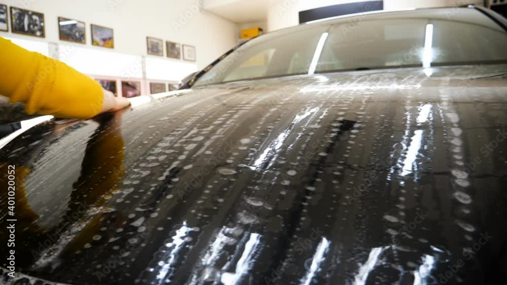 Close up to PPF installation process on a front rear headlight and ...