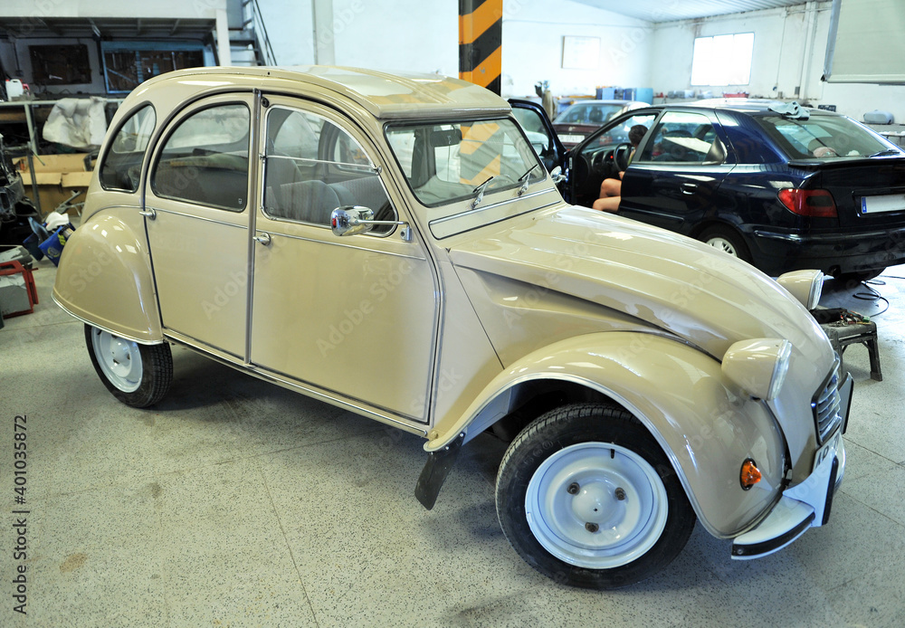 Citroën 2CV parked in a garage. A classic French car and an icon of ...