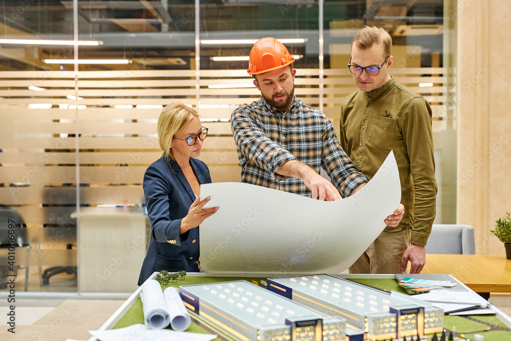 engineer show plan for house building to female director of company ...