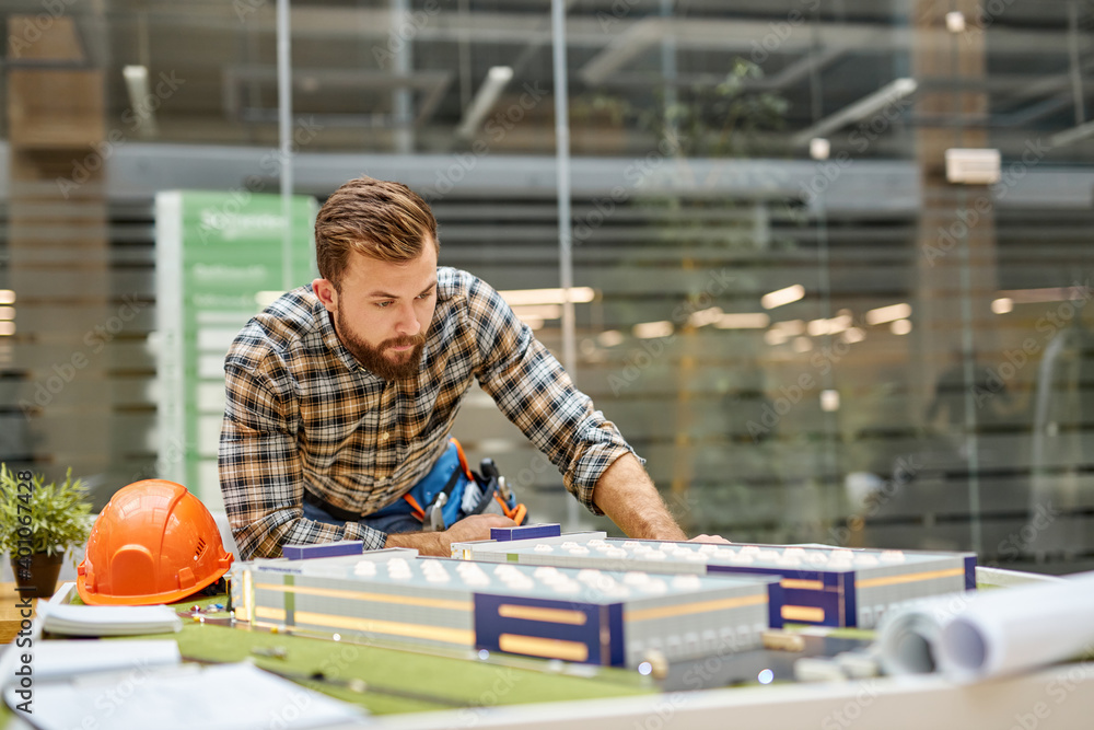 young student architect working on architectural project concept, using ...