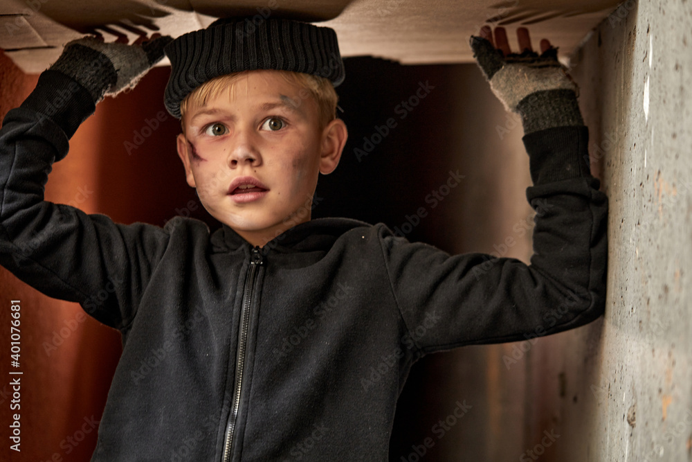 street boy alone outdoors, he needs shelter, caucasian child has dirty ...