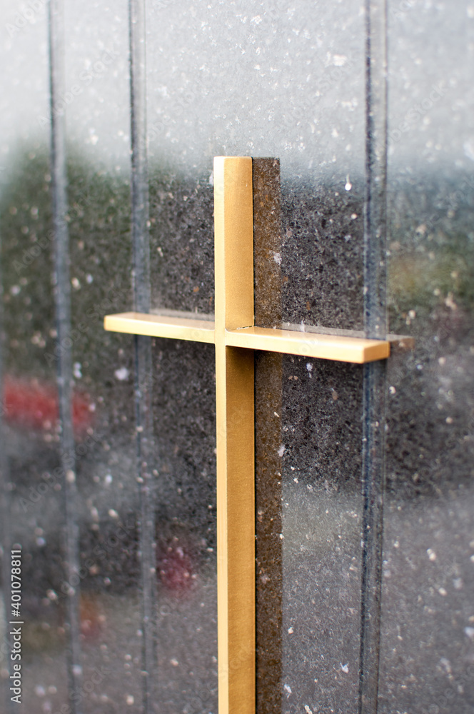 Gold cross symbol isolated on granite background Stock Photo | Adobe Stock